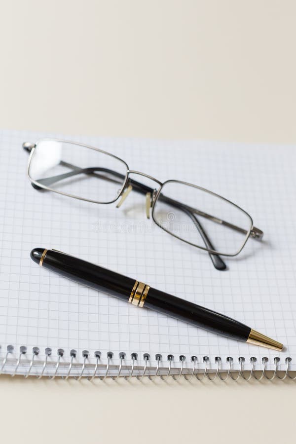 Black Pen and Glasses with White Pad or Notepad Stock Image - Image of ...