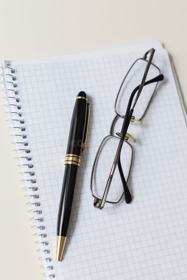 Black Pen and Glasses with White Pad or Notepad Stock Image - Image of ...