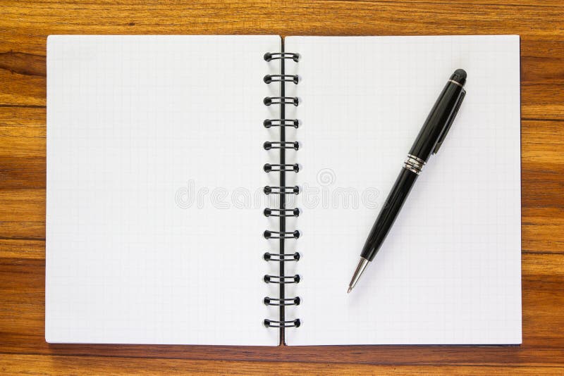 Black Pen on a Notebook with a Grid. Stock Photo - Image of notepad ...