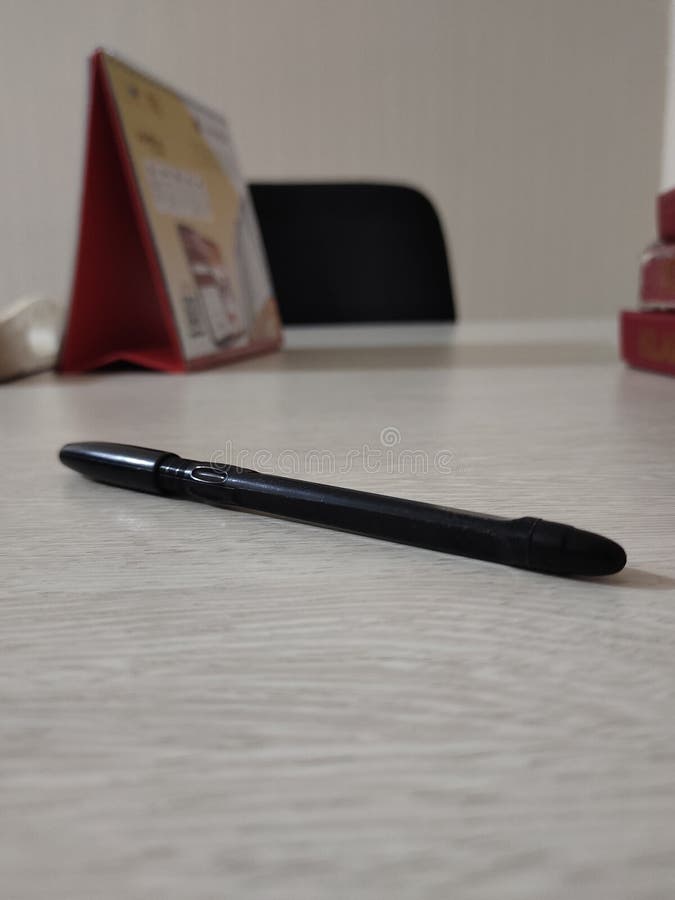 A Black Pen on the Wood Table in Office Stock Photo - Image of work ...