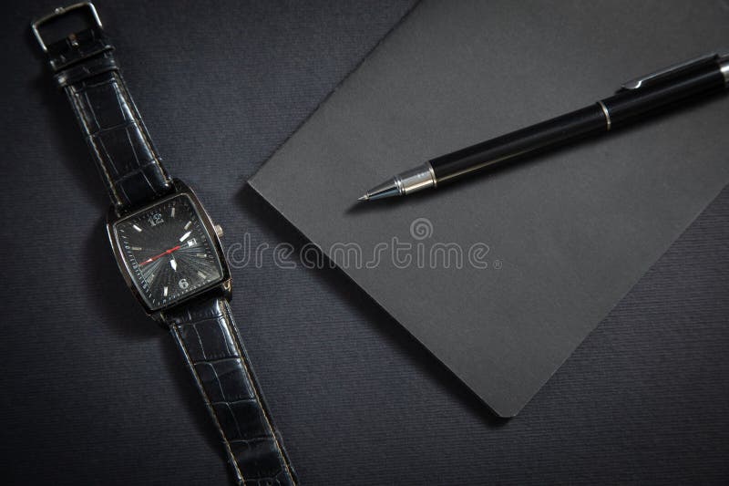 Black Pen, Wristwatch, Notepad on the Black Background Stock Photo ...