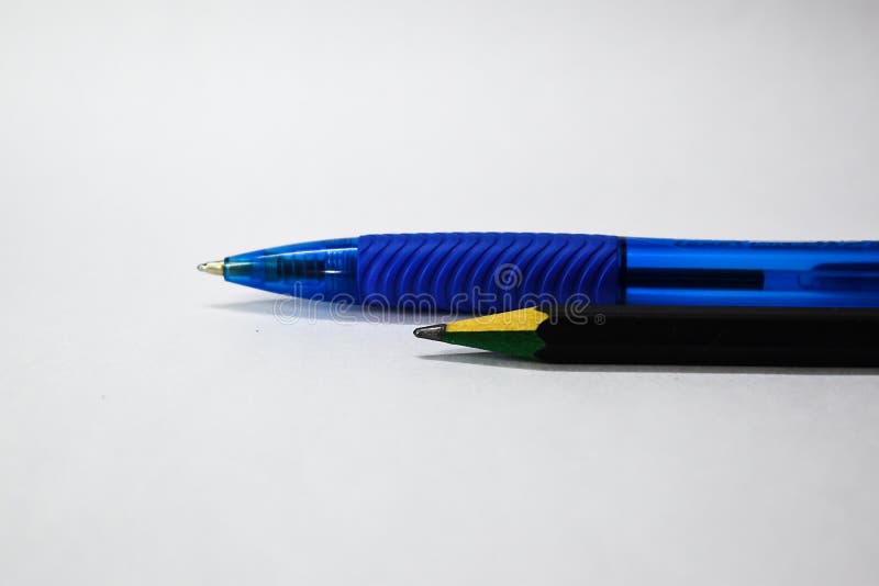Black Pencil and Blue Pen Isolated on White Background. Selective Focus ...