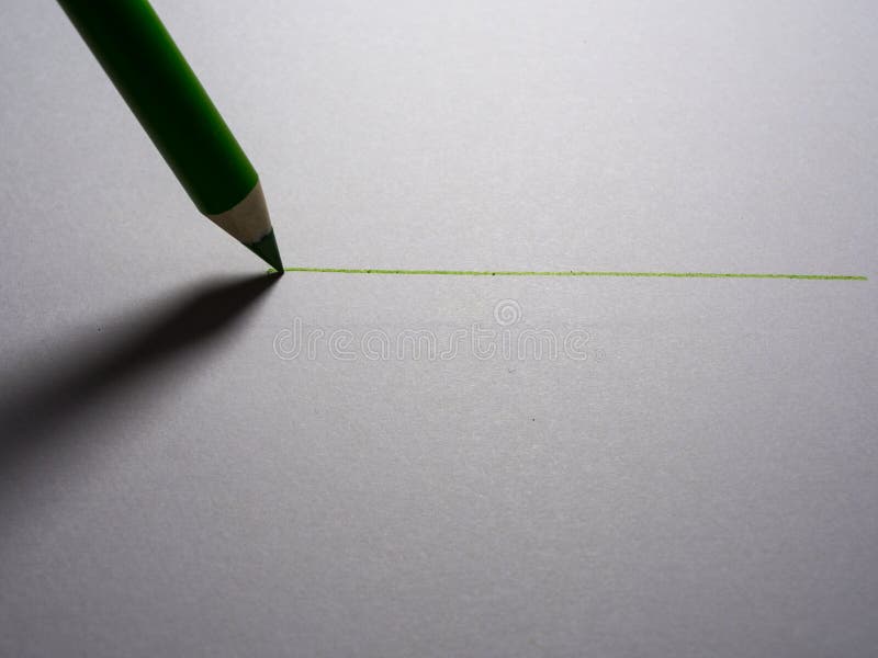 A Black Pencil Draws a Line on a White Piece of Paper Stock Photo ...