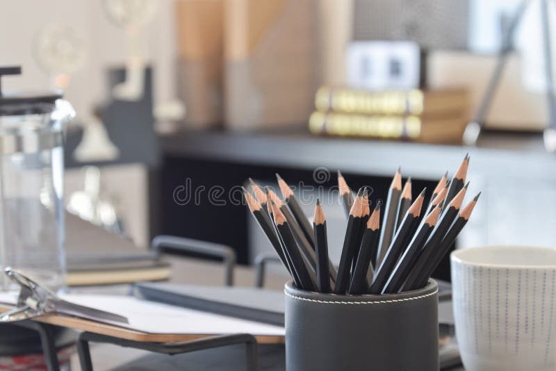Black Pencils on Working Table Stock Image - Image of clock, pencil ...