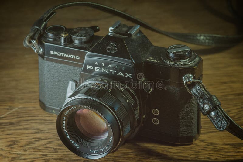 Black Pentax Digital Camera On Brown Surface Picture. Image: 83057938