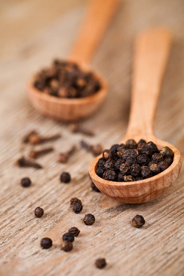 Black Pepper and Cloves in Wooden Spoons Stock Image - Image of brown ...