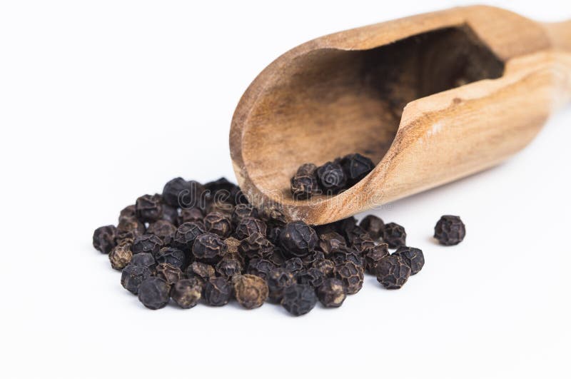 Black Pepper with spoon stock photo. Image of grain, organic - 64365862