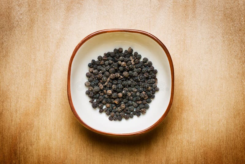 Black pepper on wood table stock photo. Image of nature - 24067552