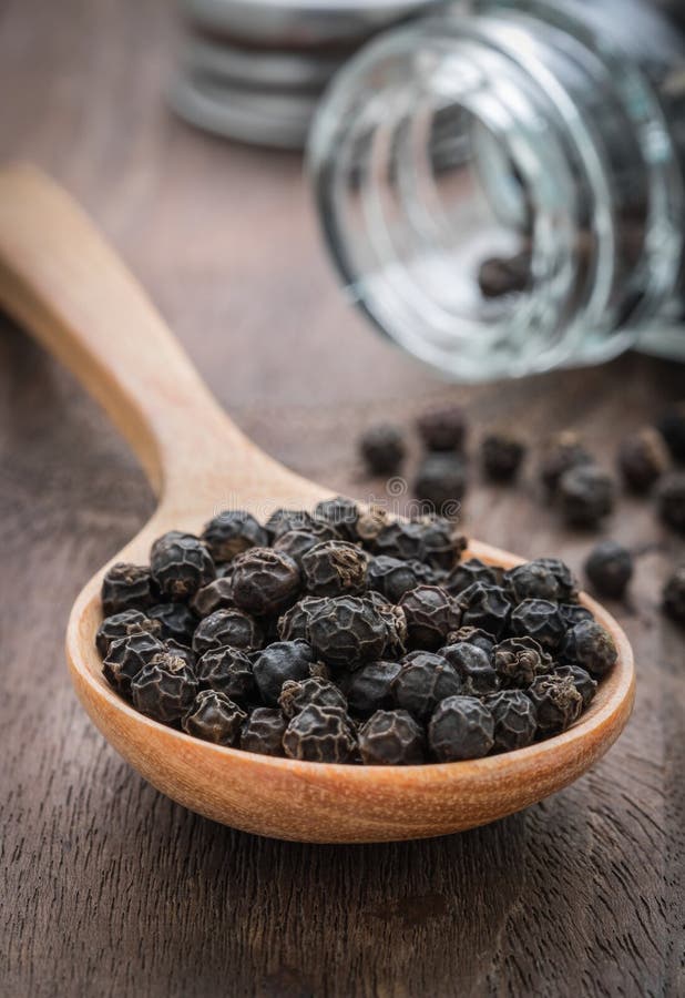 Black Pepper on Wooden Spoon Stock Image - Image of wood, wooden: 56709617