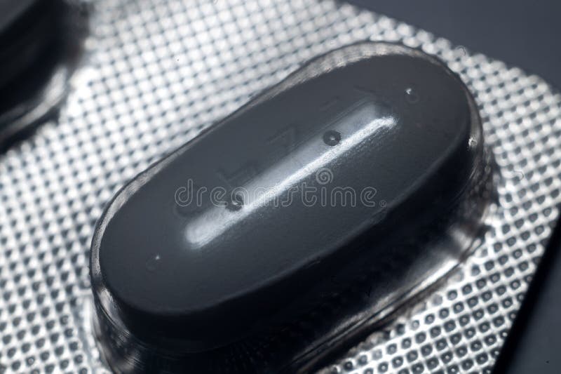 Black Pill in the Package Macro Stock Image - Image of symbol, dose ...