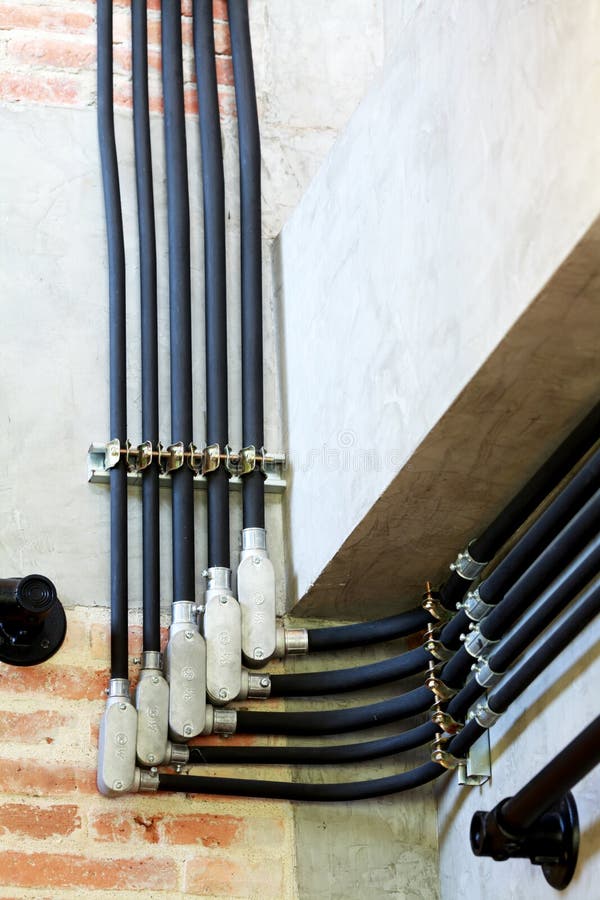 Pipeline on the wall stock photo. Image of outlet, bolt - 251690336