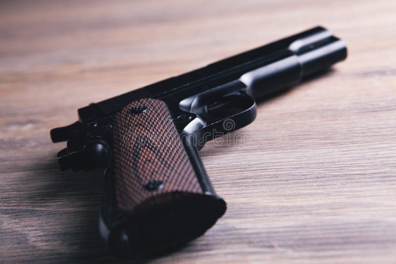 Black Pistol Lying on the Table Stock Photo - Image of criminal, metal ...