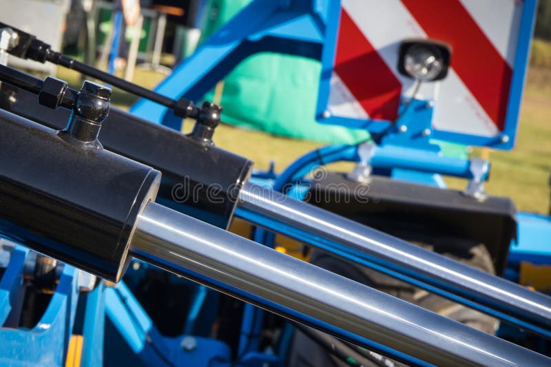 Black Pistons or Actuators in Blue Pneumatic or Hydraulic Machine ...