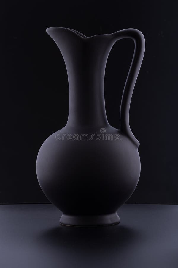 Black Pitcher, Outlined with Light, on a Black Background. Classic ...