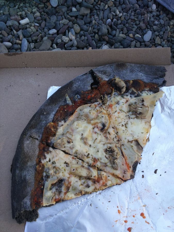 Black pizza stock image. Image of charcoal, pizza, dough - 132855835