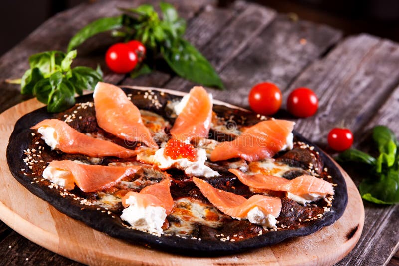 Black Pizza with Red Fish Salmon and Cream Cheese Stock Image - Image ...