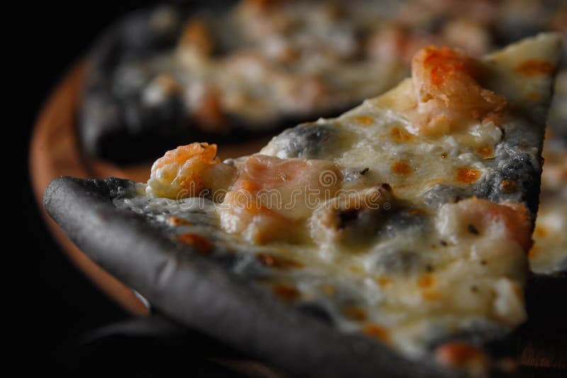 Black Pizza. Made with Cuttlefish and Black Olives. Stock Image - Image ...