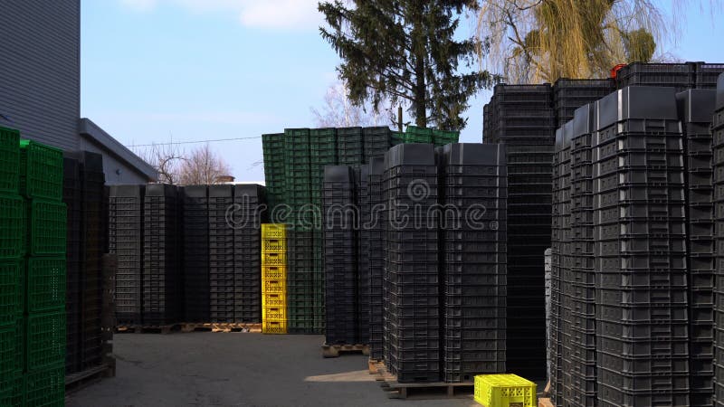 Black Plastic Boxes in a Warehouse Outdoor. Stock Video - Video of ...