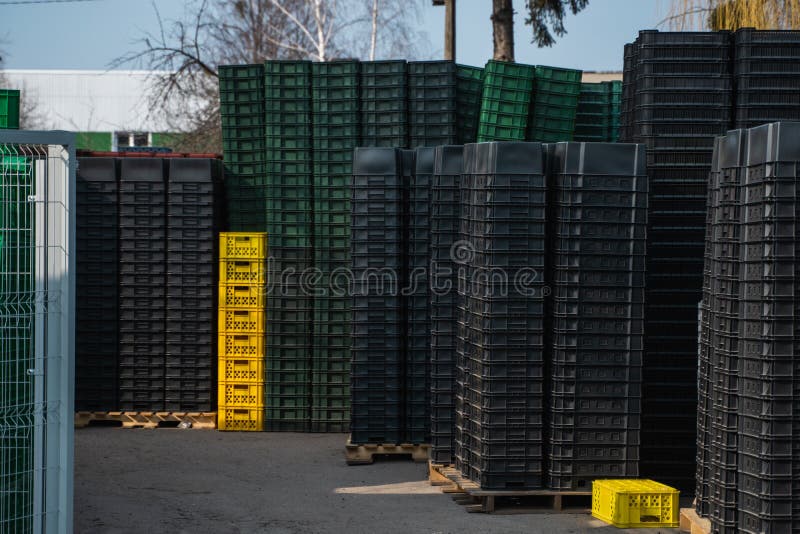 Black Plastic Boxes in a Warehouse Outdoor. Stock Photo - Image of ...