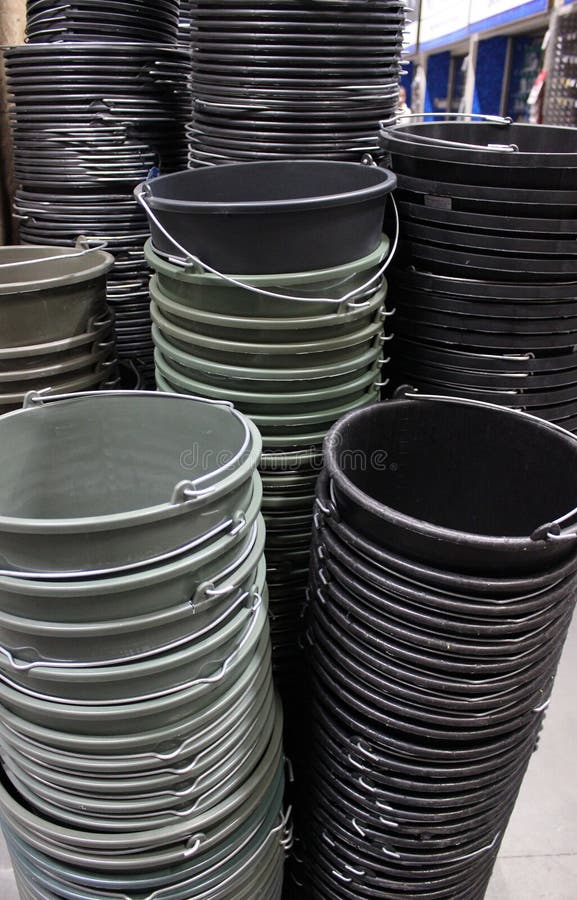 Construction Plastic Pails Stacked in a Columns at a Storage Area ...