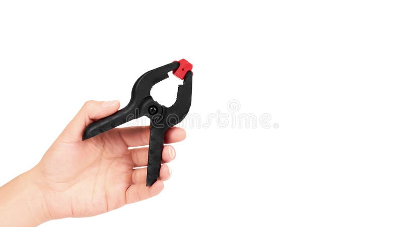 Black Plastic Clamp in Hand Isolated on White Background Stock Photo ...