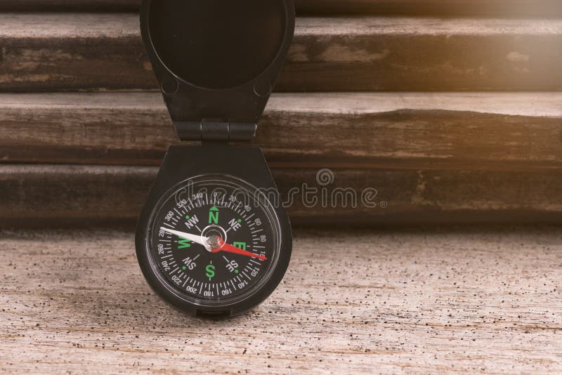 Black Plastic Compass on Grunge Rustic Wood Stock Photo - Image of ...