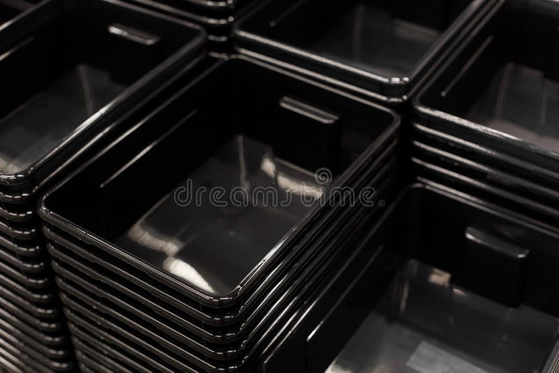 Black Plastic Containers Stack in a Store Stock Image - Image of ...
