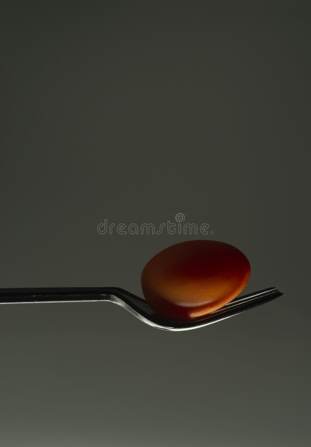 Black Plastic Fork and Spoon with Water Drops and Tomato Showing ...