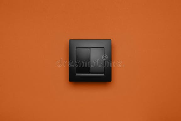 Black Plastic Light Switch on Orange Background Stock Image - Image of ...
