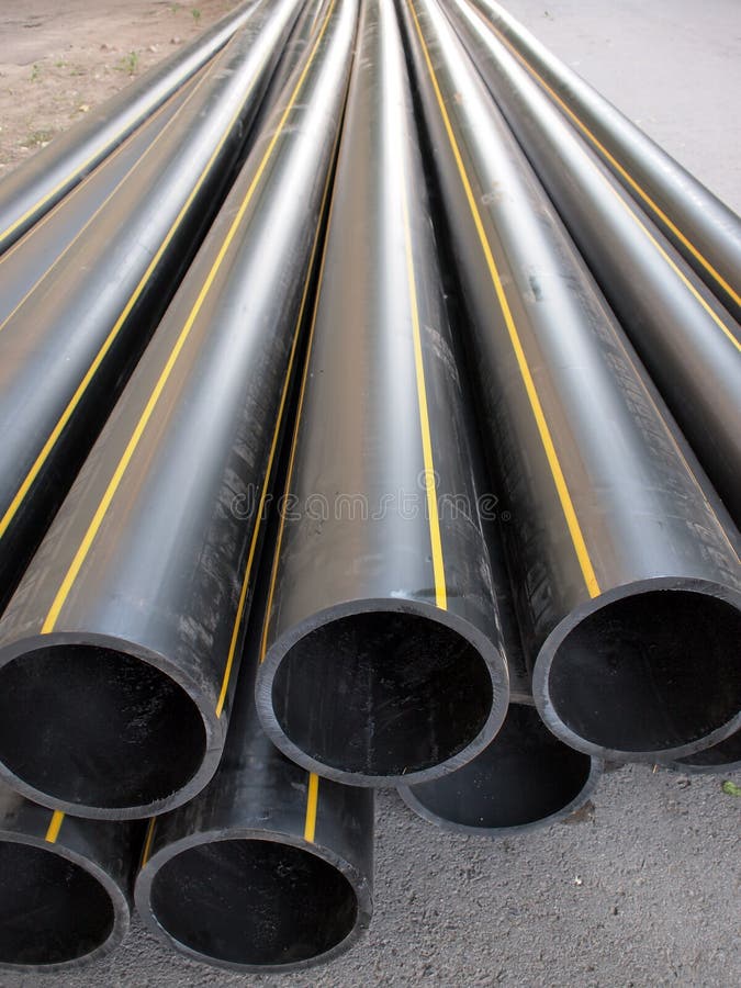 Black Plastic PVC Pipe Lying on the Street Stock Photo - Image of bokeh ...