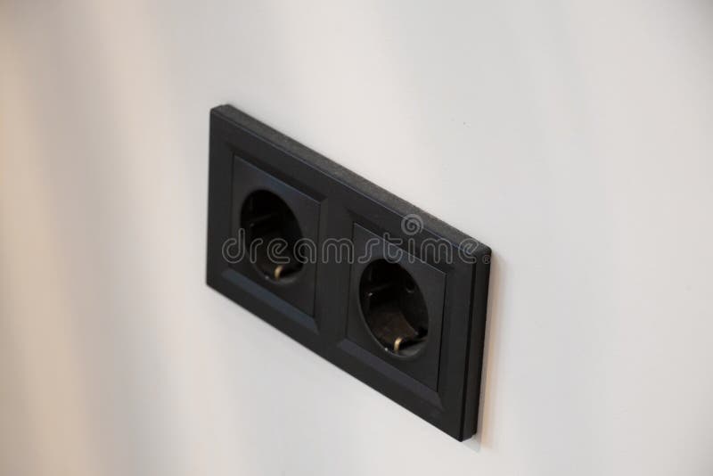 Black Plastic Socket on the White Wall of the House Stock Image - Image ...