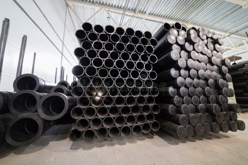 Black Plastic Tubes in the Manufacturing Storage Stock Photo - Image of ...