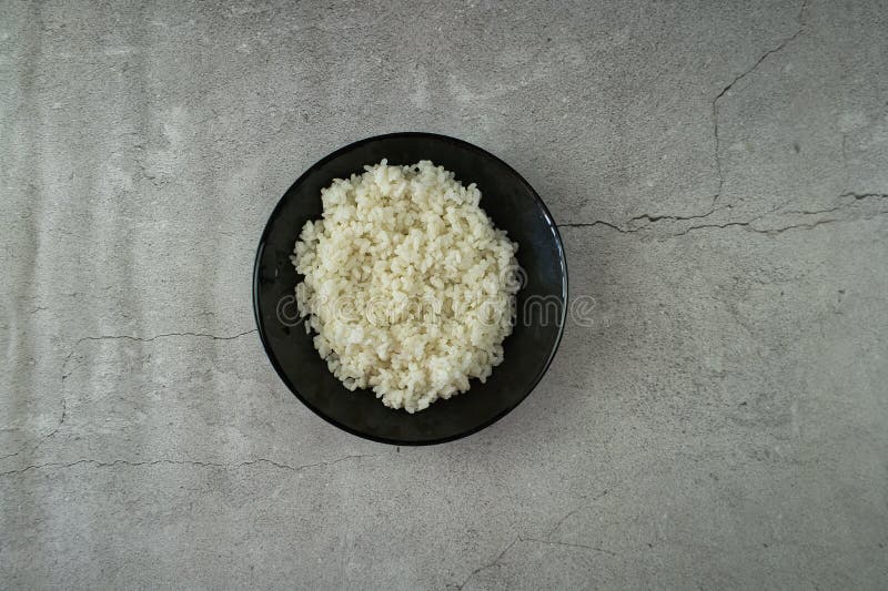 Black Plate with Cooked Rice on the Table Stock Image - Image of ...