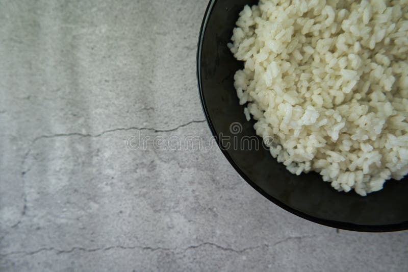 Black Plate with Cooked Rice on the Table Stock Image - Image of ...