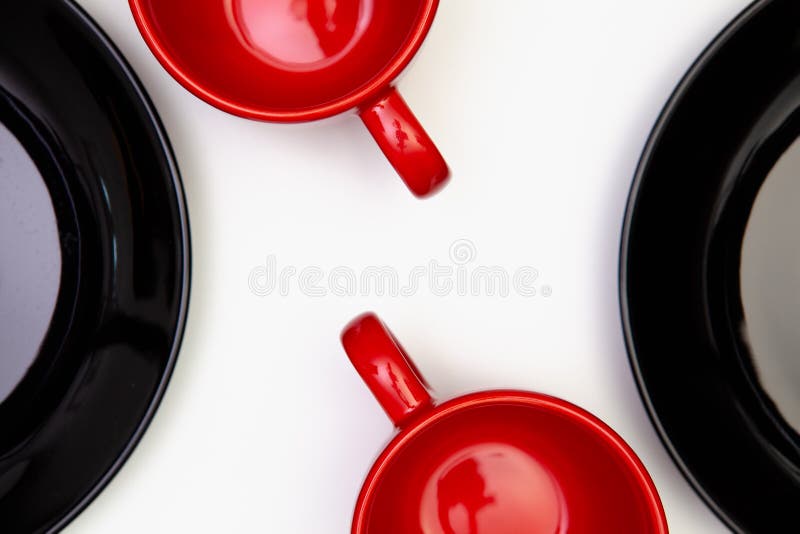Black Plates and Red Cups on the White Table Stock Image - Image of ...