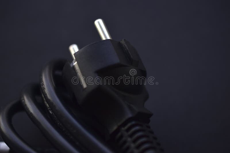 Black Plug of the Computer Power Cable on a Black Background Stock ...