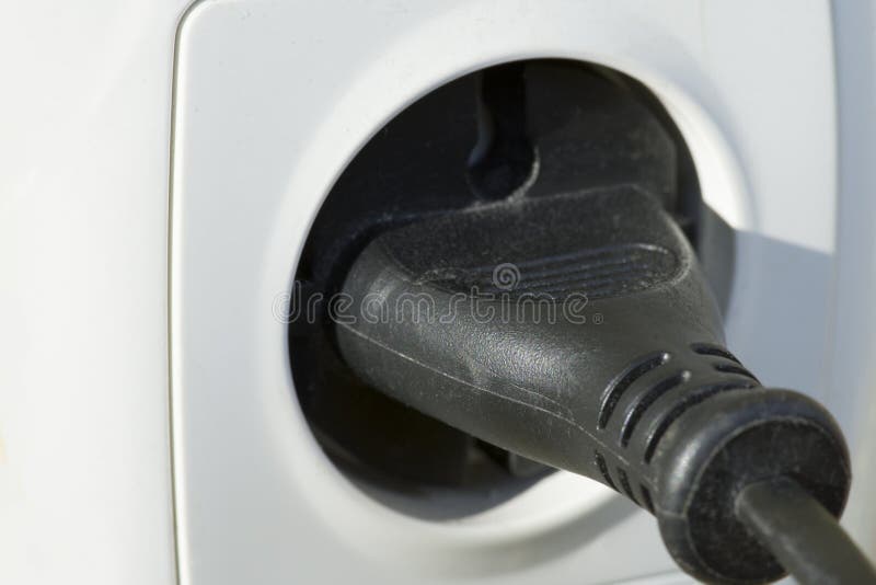 Black Plug in a White Socket. Turned on Electrical Appliance Stock ...