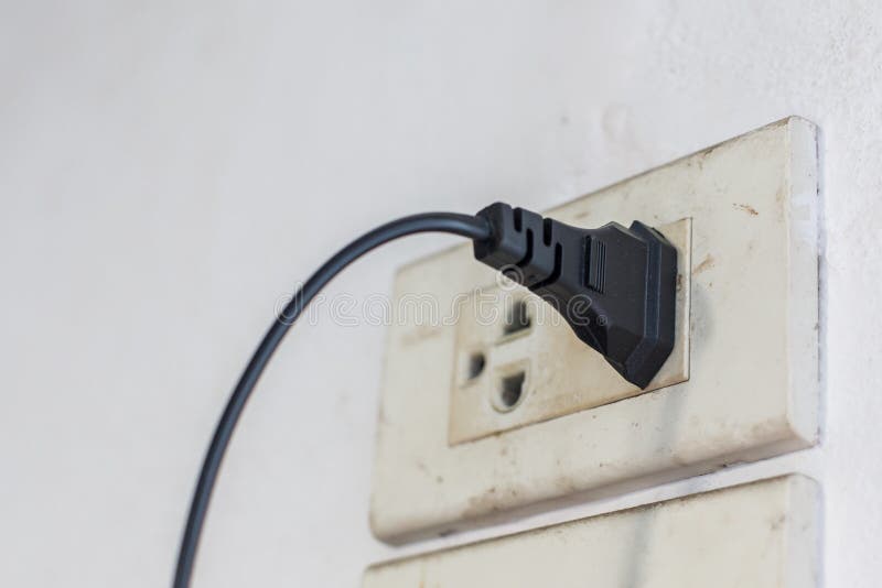 Black Plugs are Plugged into an Old Outlet Stock Photo - Image of ...