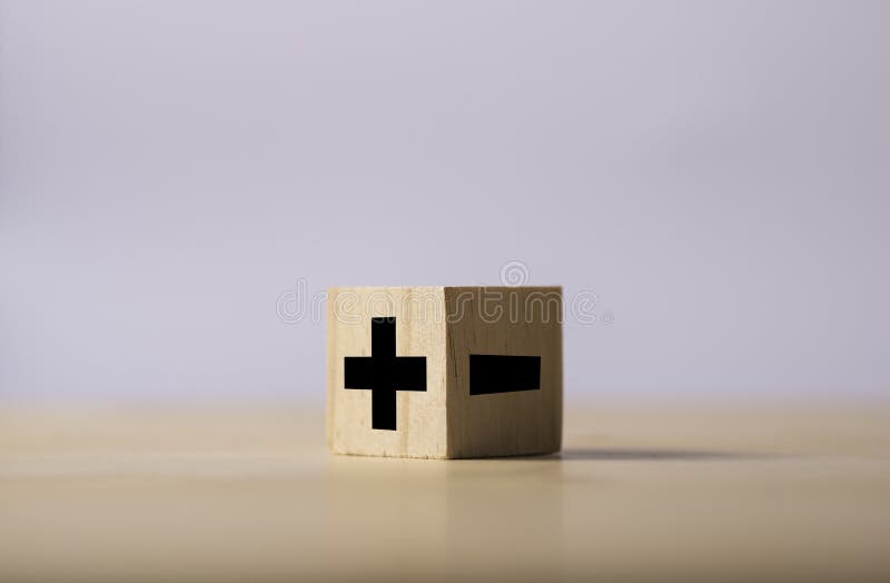 Black of Plus and Minus Sign in Opposite Side of Wooden Cube Stock ...
