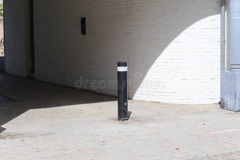 Black pole on the street stock image. Image of street - 259165339