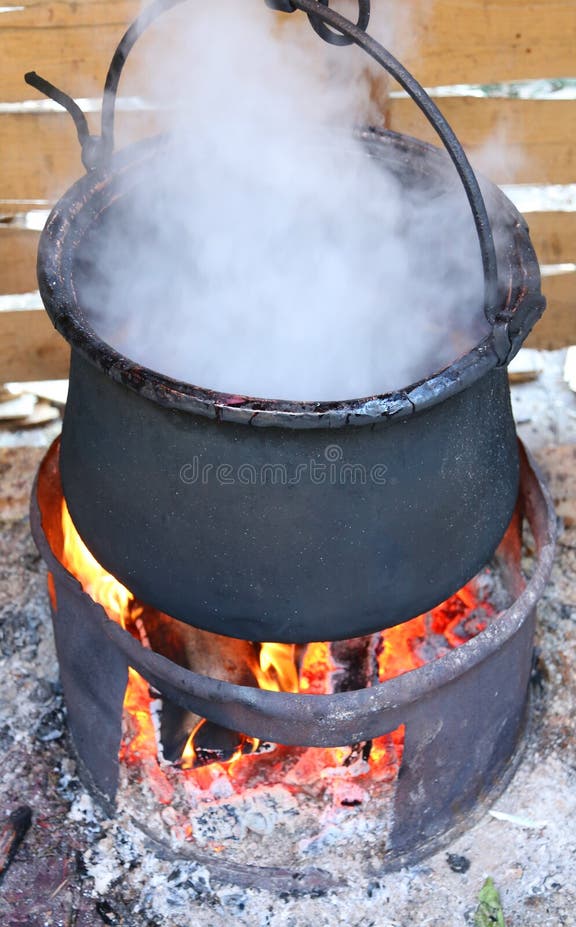 Black Pot with the Fire and the Smoke during Cooking Stock Photo ...