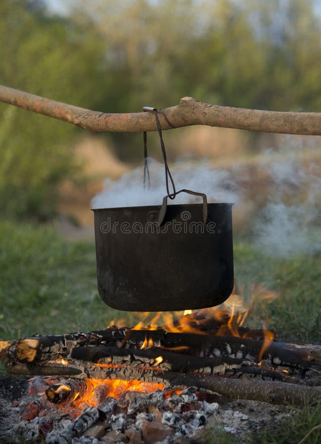 Black pot over fire stock image. Image of summer, flame - 95605753