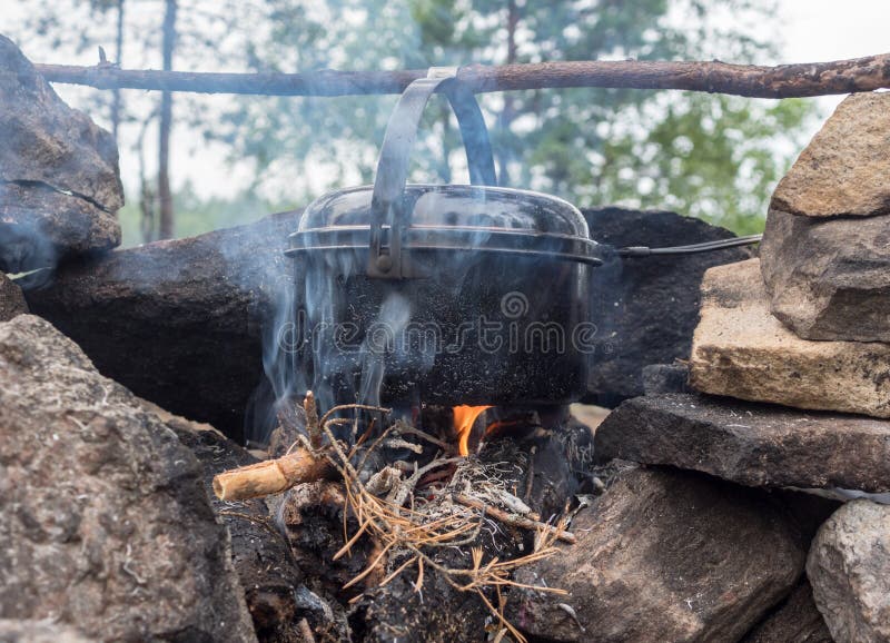 Black Pot in a Stone Hearth Stock Image - Image of wood, campfire ...