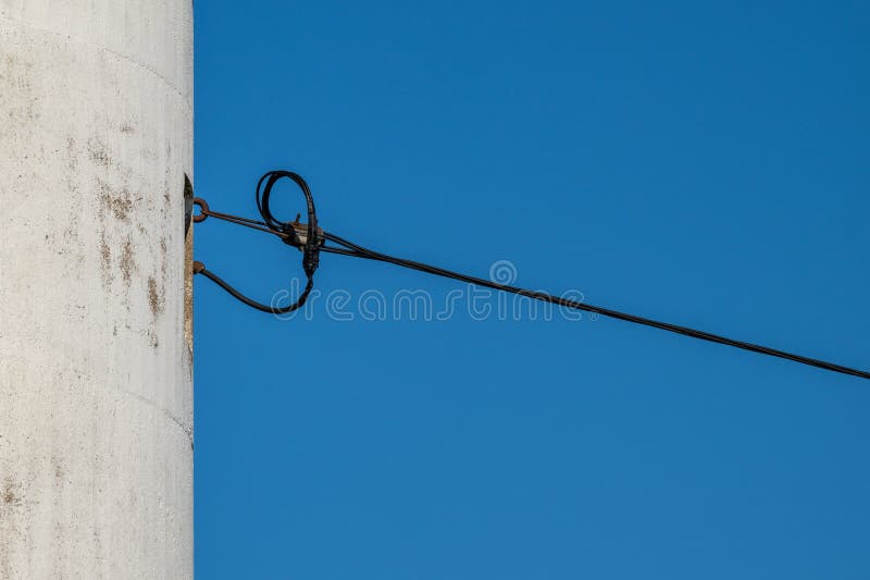 Black Power Cable Fastened To a White Concrete Structure.. Stock Image ...
