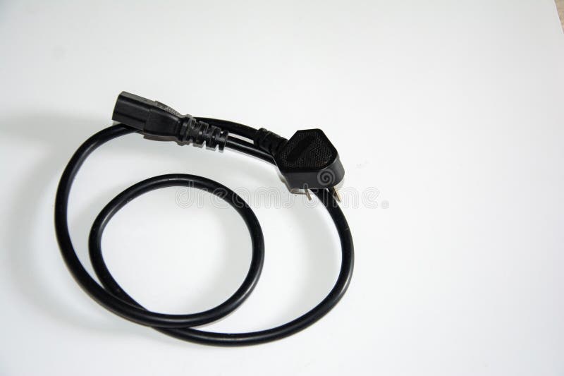 The Black Lettered Power Cord is Coiled on a White Background, with ...