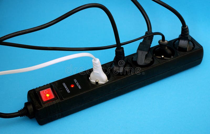 Black Power Surge Protector with Cables and Light on Blue Background ...