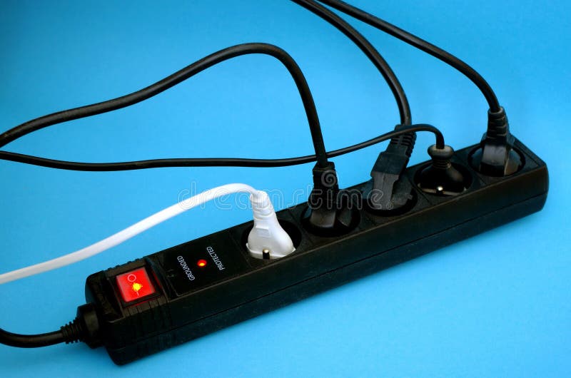 Black Power Surge Protector with Cables and Light on Blue Background ...