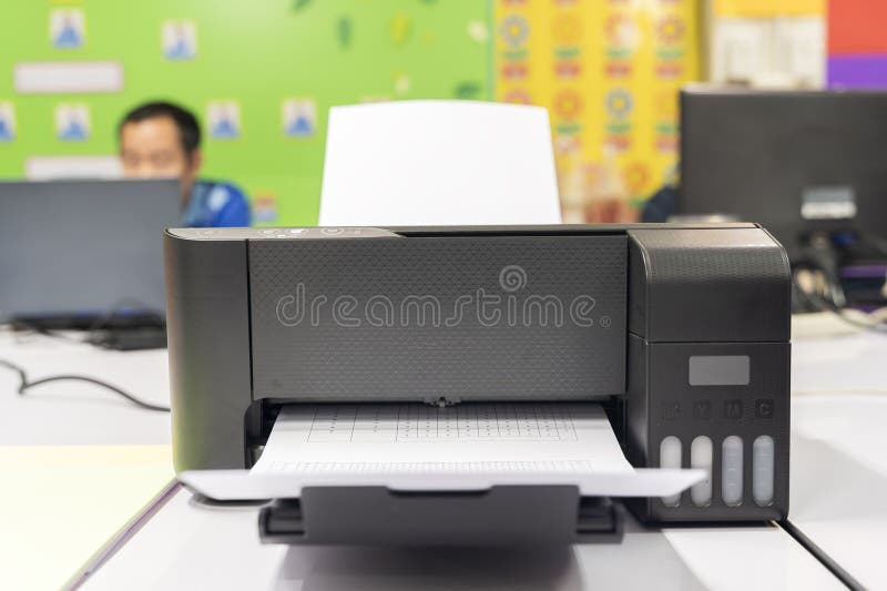 A Black Printer is Open and Has a White Sheet of Paper Inside Stock ...