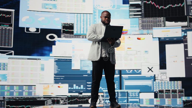 Black Professional Administrator Examining Digital Dashboard with ...