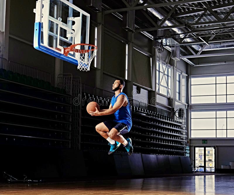 Professional Basketball Player in Action on a Basketball Field. Stock ...